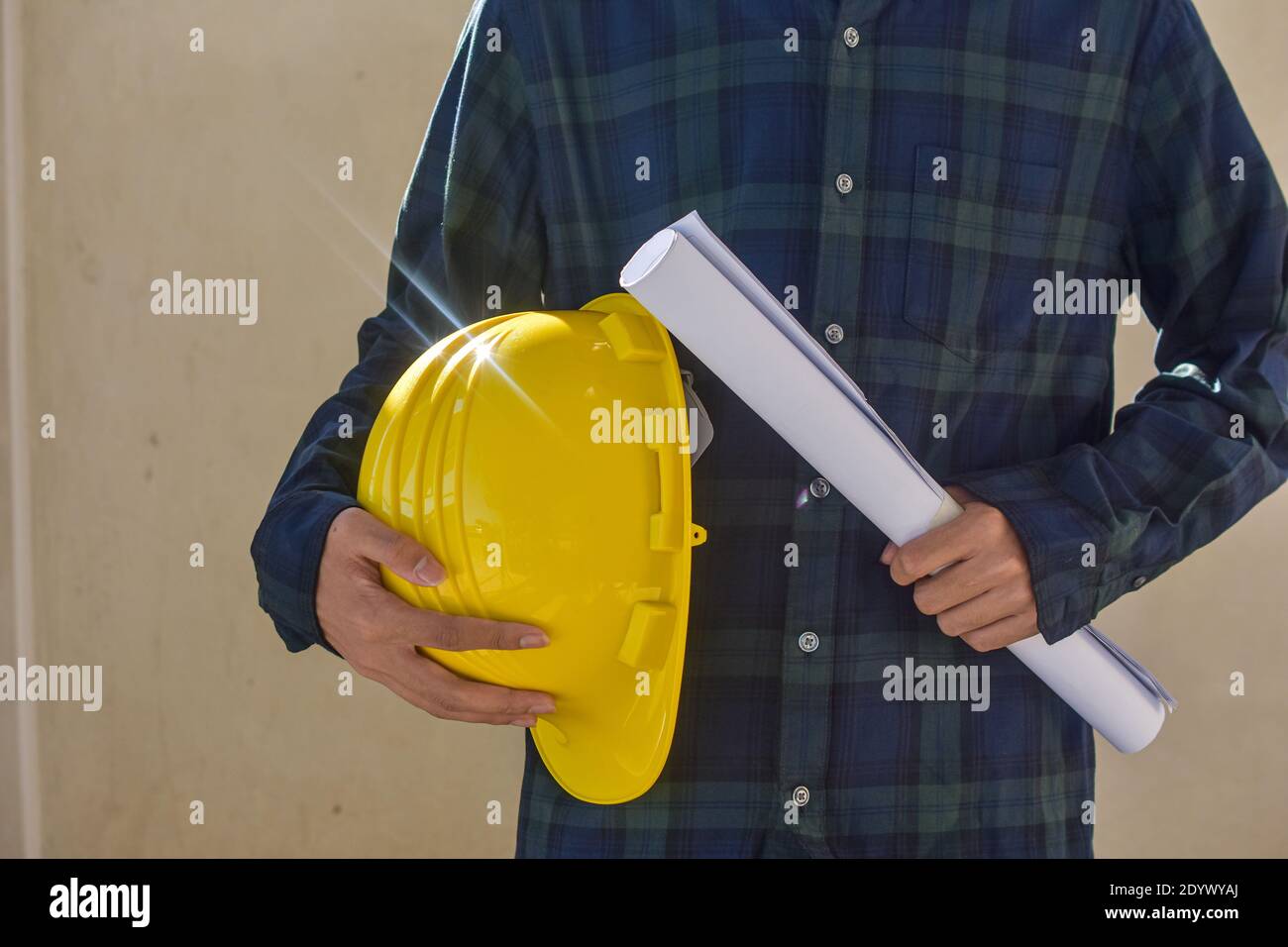 Supervisor holding helmet blueprint architect construction concept ...