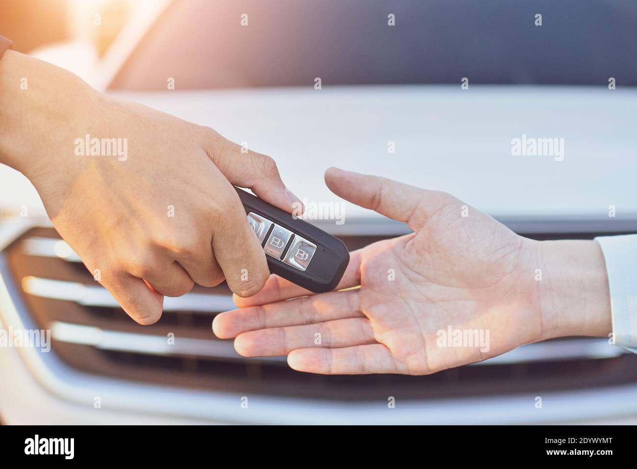Salesman giving key car to customer,Car sale concept Stock Photo - Alamy