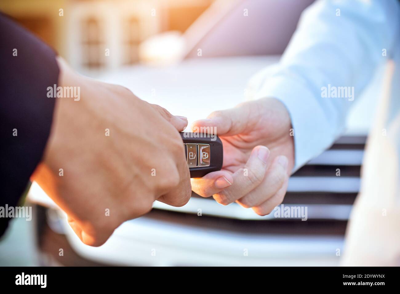 Salesman giving key car to customer,Car sale concept Stock Photo - Alamy