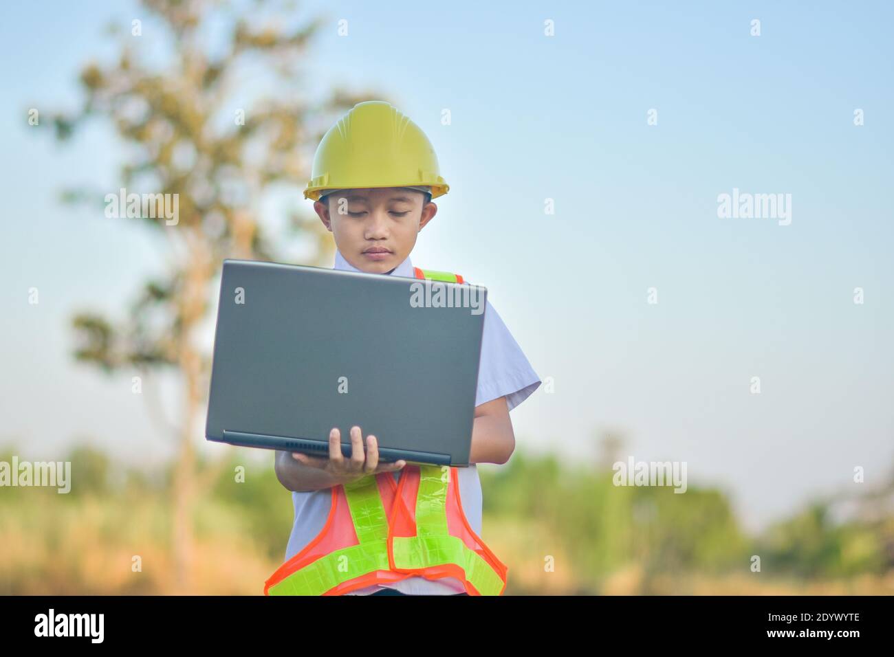 Boy Engineer Helmet hardhat safety use computer notebook Stock Photo ...