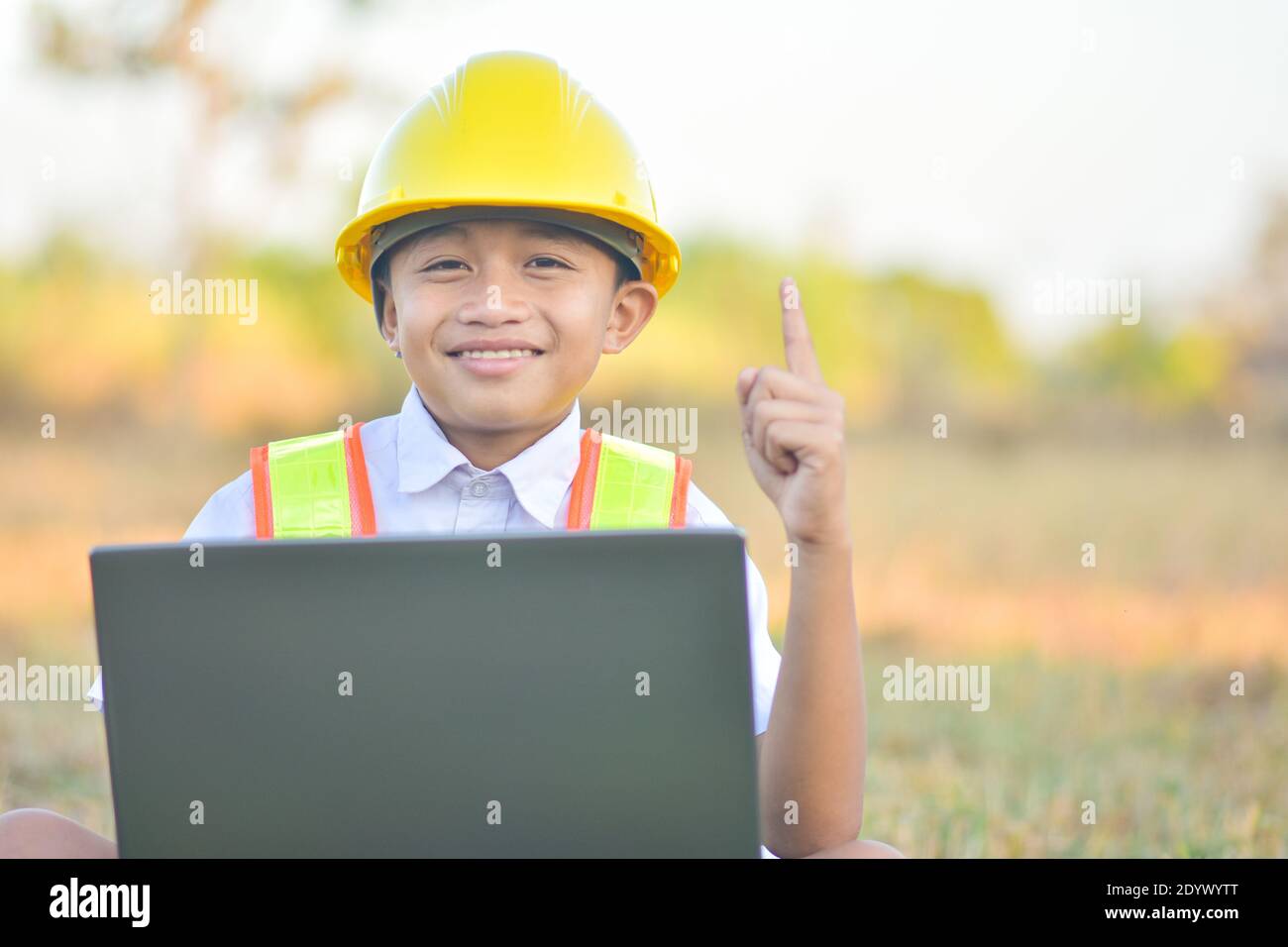 Boy Engineer Helmet hardhat safety use computer notebook Stock Photo ...
