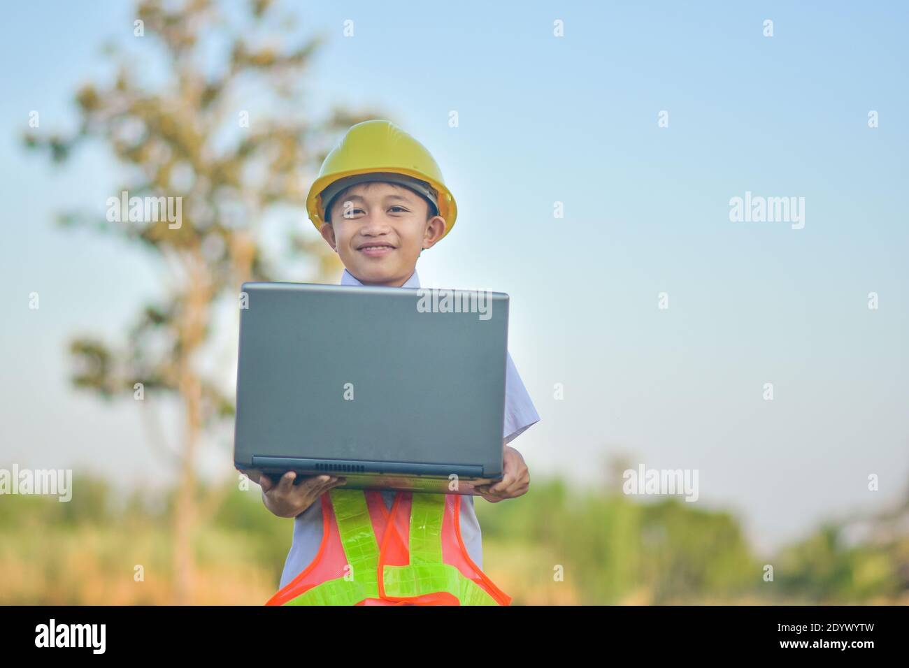 Boy Engineer Helmet hardhat safety use computer notebook Stock Photo ...