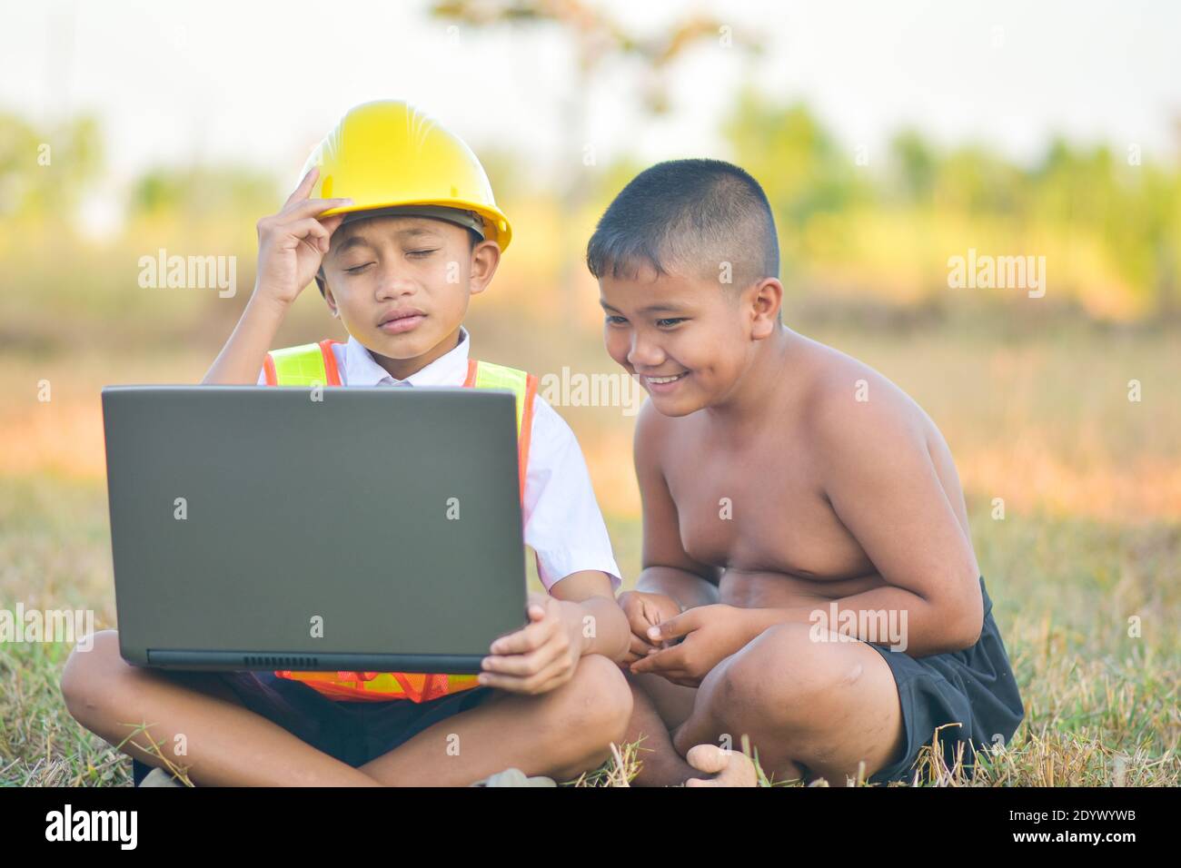 Boy Engineer Helmet hardhat safety use computer notebook Stock Photo ...