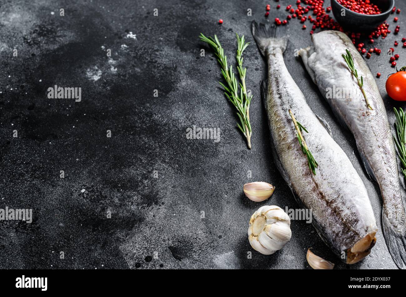 Raw Pollock fish with rosemary and pink pepper. Organic seafood. Black ...