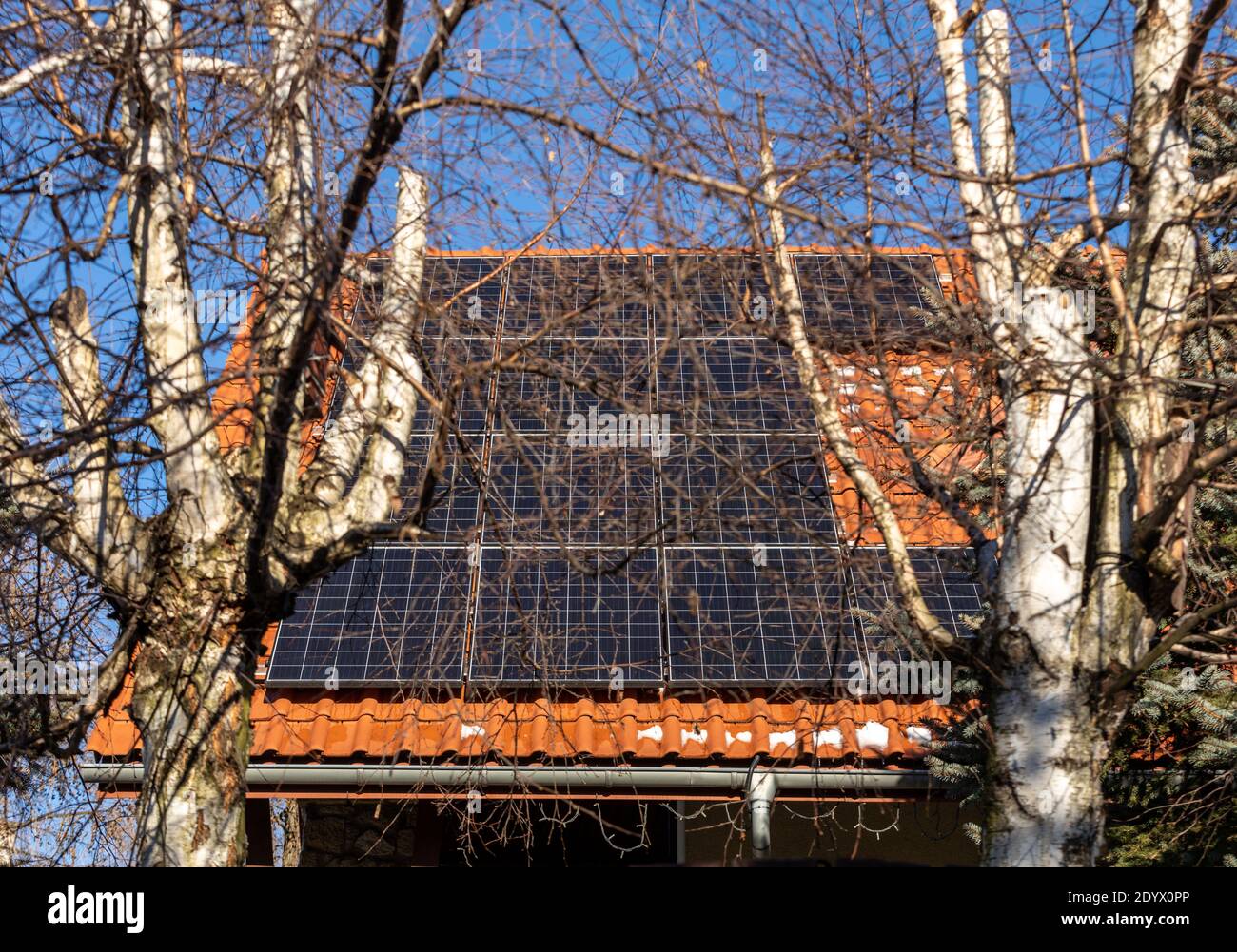 Solar electric panels on a house roof Stock Photo - Alamy