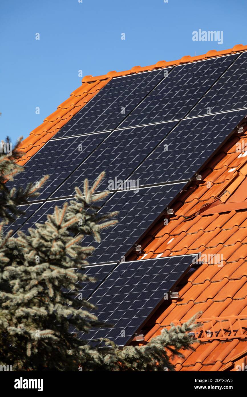 Solar electric panels on a house roof Stock Photo - Alamy