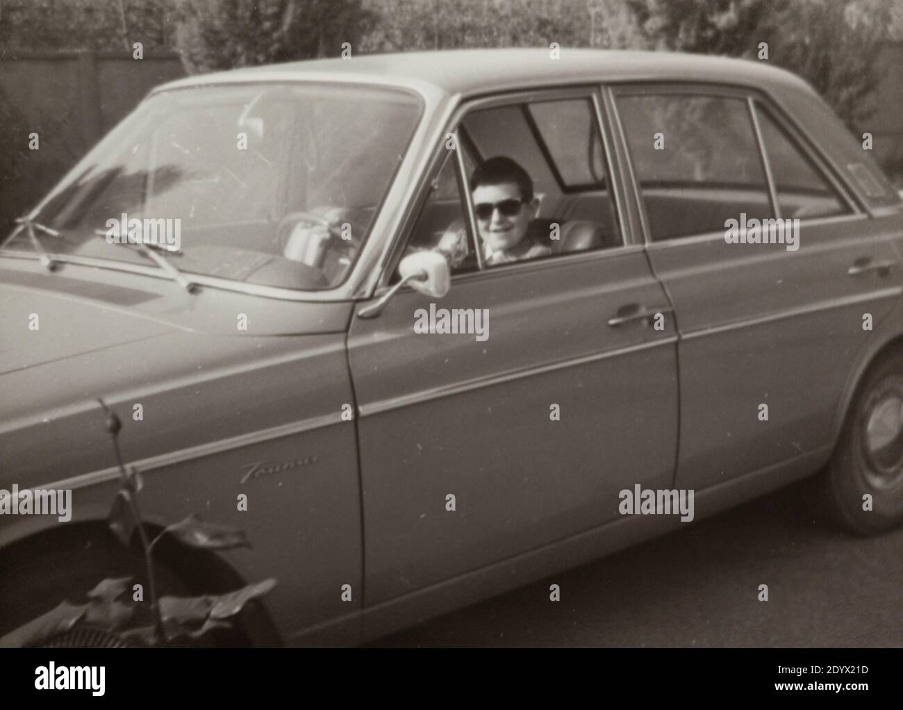 VILLANOVA DEL GHEBBO, ITALY APRIL 1964: Little boy drives the car in ...