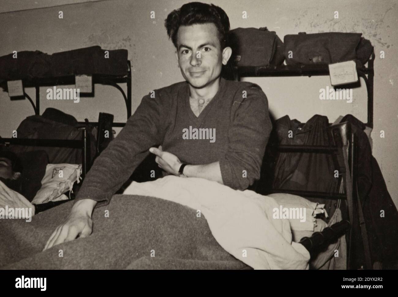 Man sleeping in cot in hi-res stock photography and images - Alamy