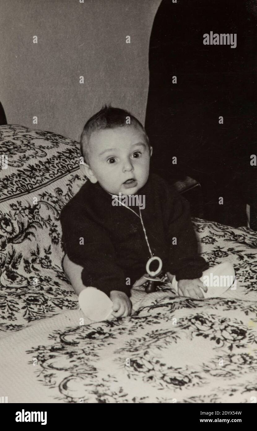 ROVIGO, ITALY OCTOBER 1958: Baby in the bed in 50s Stock Photo - Alamy