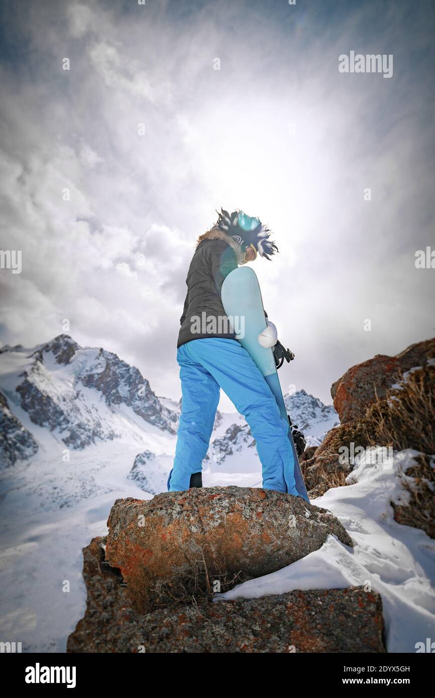 Back view snowboarder in high mountain. Copy space Stock Photo - Alamy