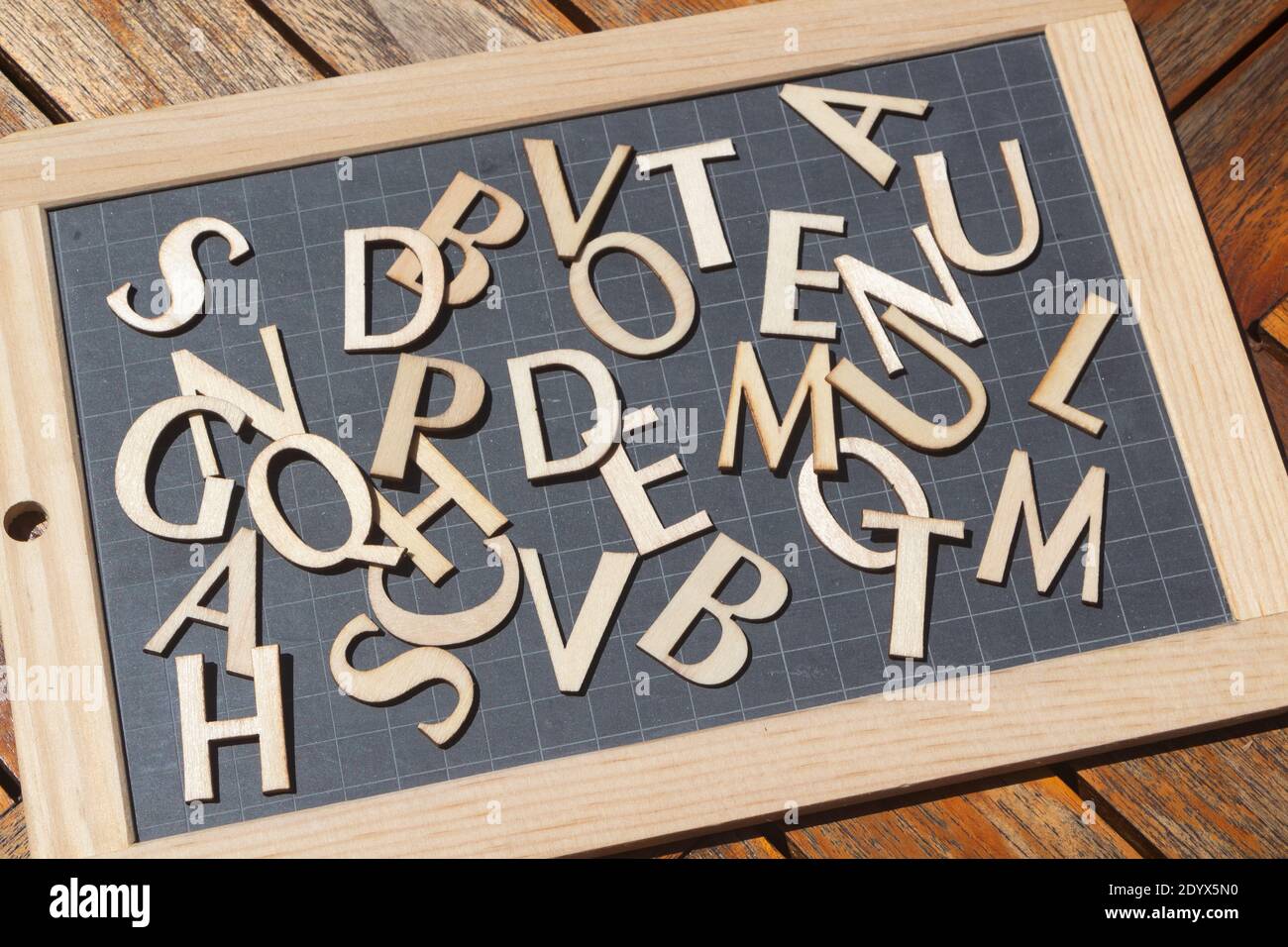 Chalkboard slate and wooden letters for teaching to children how to ...