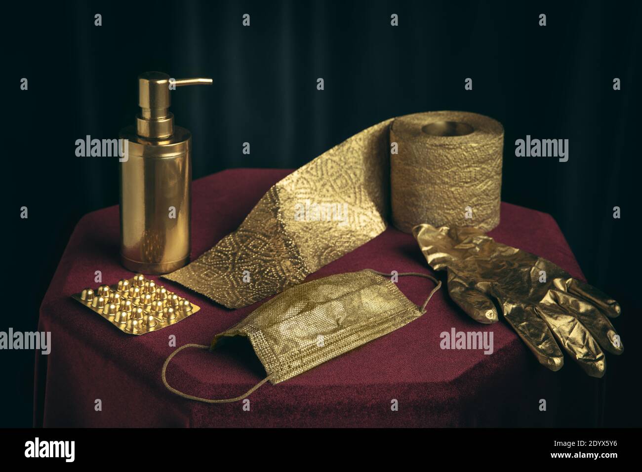 Classic still life with golden toilet paper, face mask and antiseptic ...