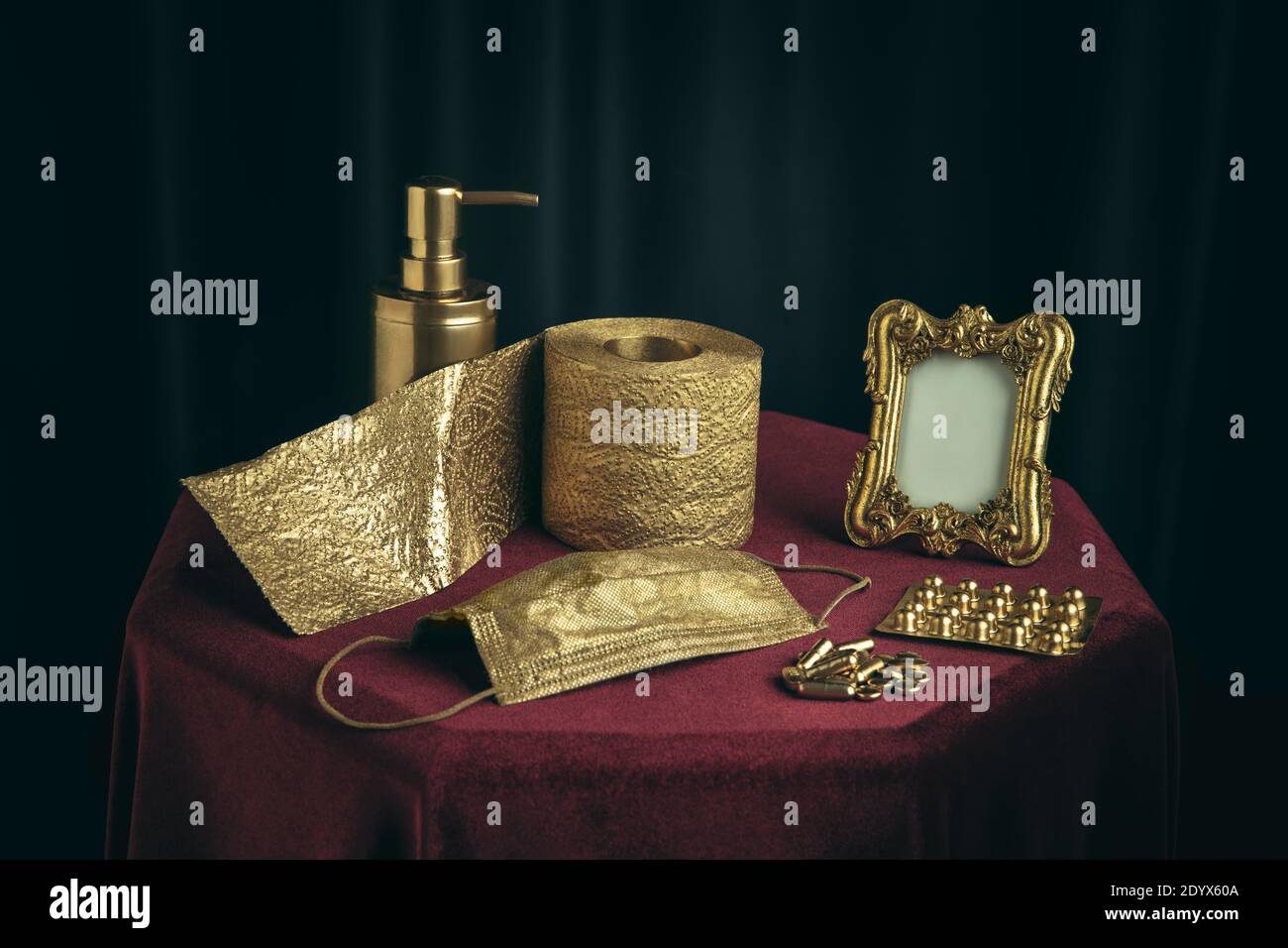 Classic still life with golden toilet paper, face mask and antiseptic ...