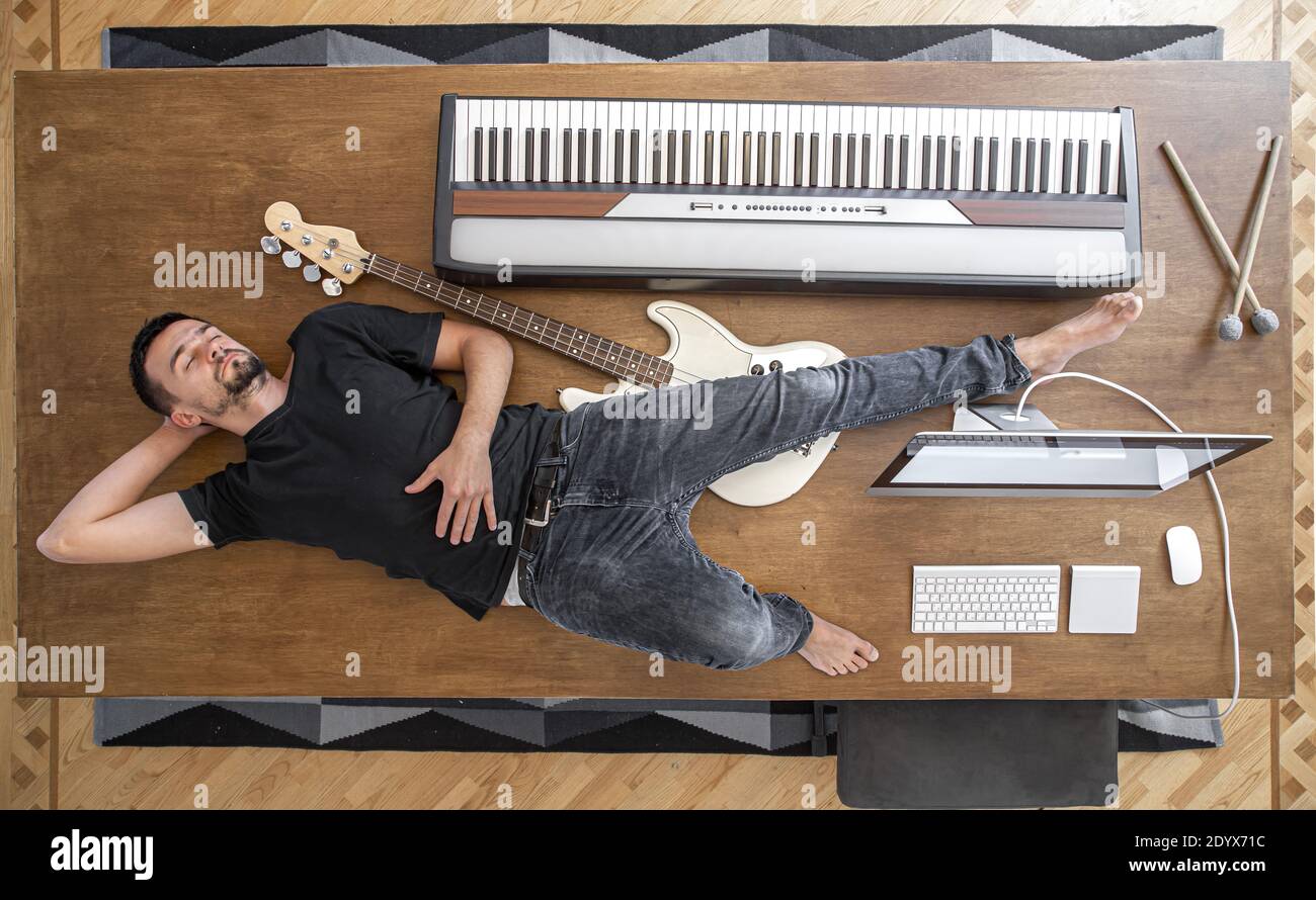 Top view composition with musical instruments on a large wooden table ...
