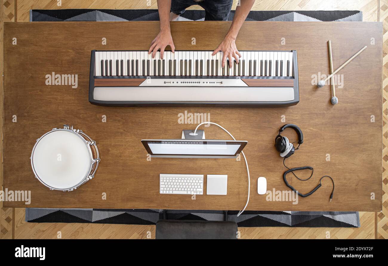 Top view of a composition of musical instruments on a wooden table in a ...