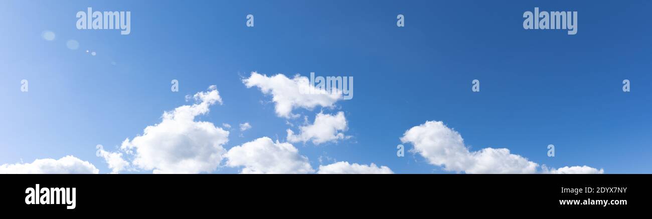 Wide blue sky with clouds panorama, creative copy space, horizontal ...