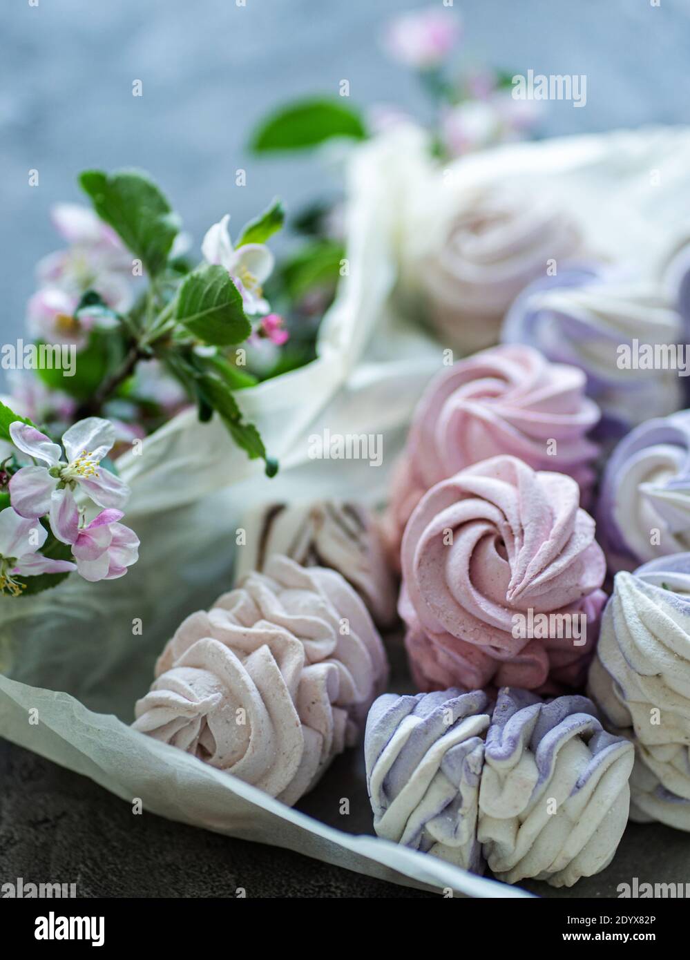Delicious marshmallow on craft paper with spring flowers Stock Photo ...