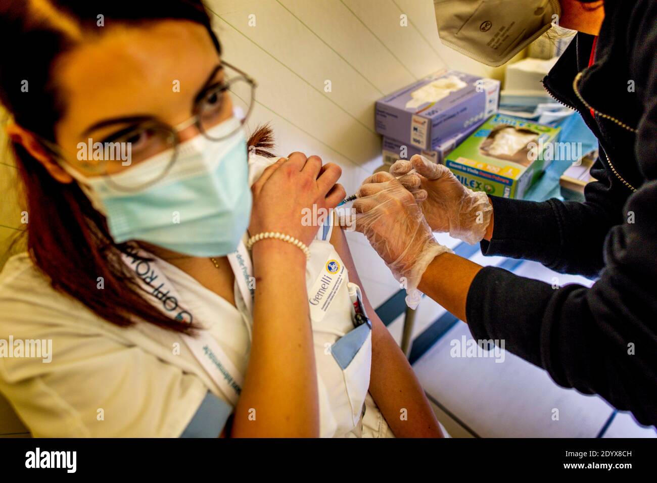 Rome, Rome, Italy. 28th Dec, 2020. A young nurse receives the first ...