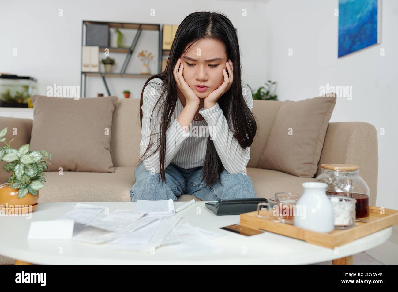 Woman looking unpaid bills hi-res stock photography and images - Alamy