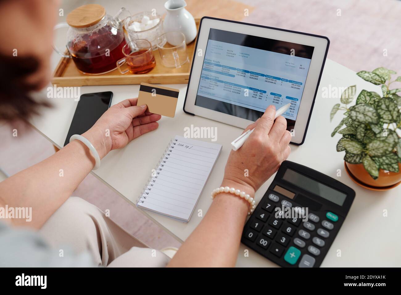 Woman smart card checking hi-res stock photography and images - Alamy