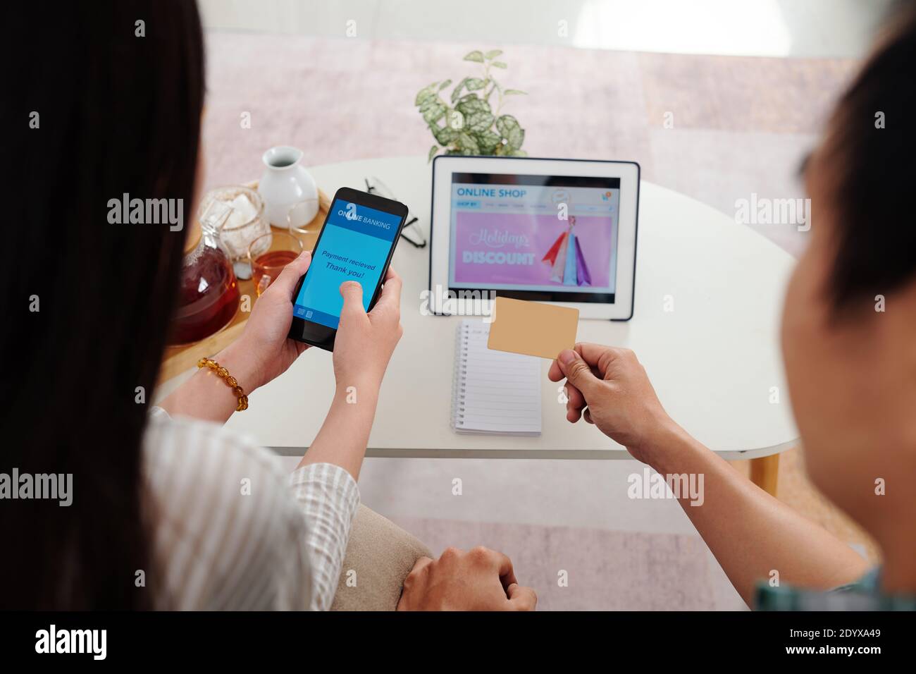 Couple making purchases online Stock Photo - Alamy