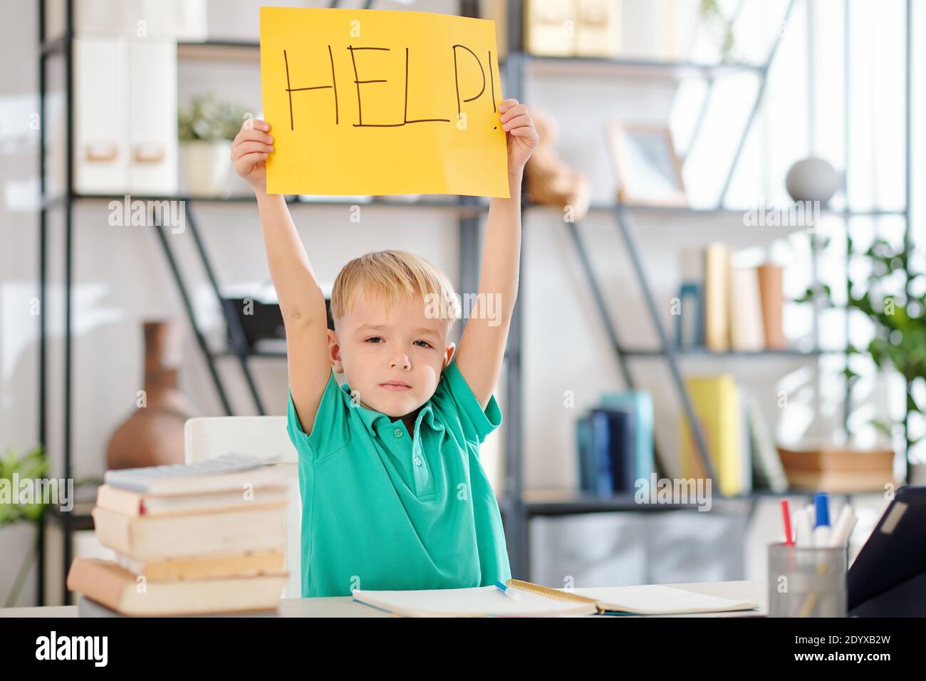 Schoolboy asking for help Stock Photo - Alamy