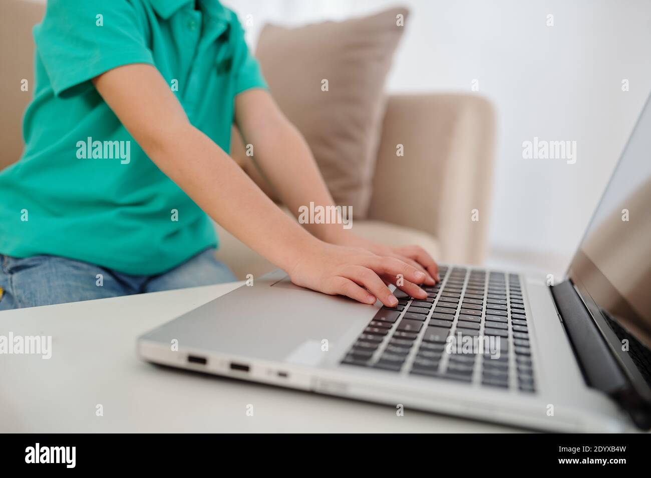 Boy typing hi-res stock photography and images - Alamy