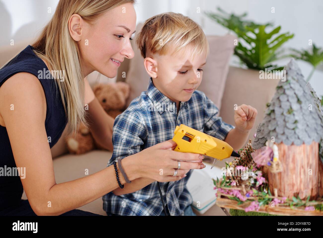 Family creating school project Stock Photo - Alamy