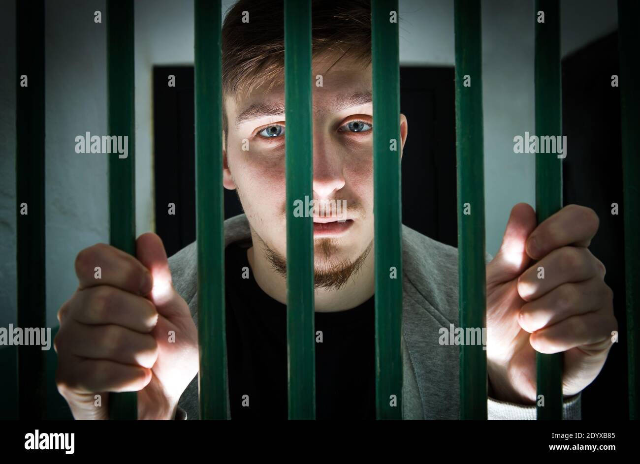 Man behind bars hi-res stock photography and images - Alamy