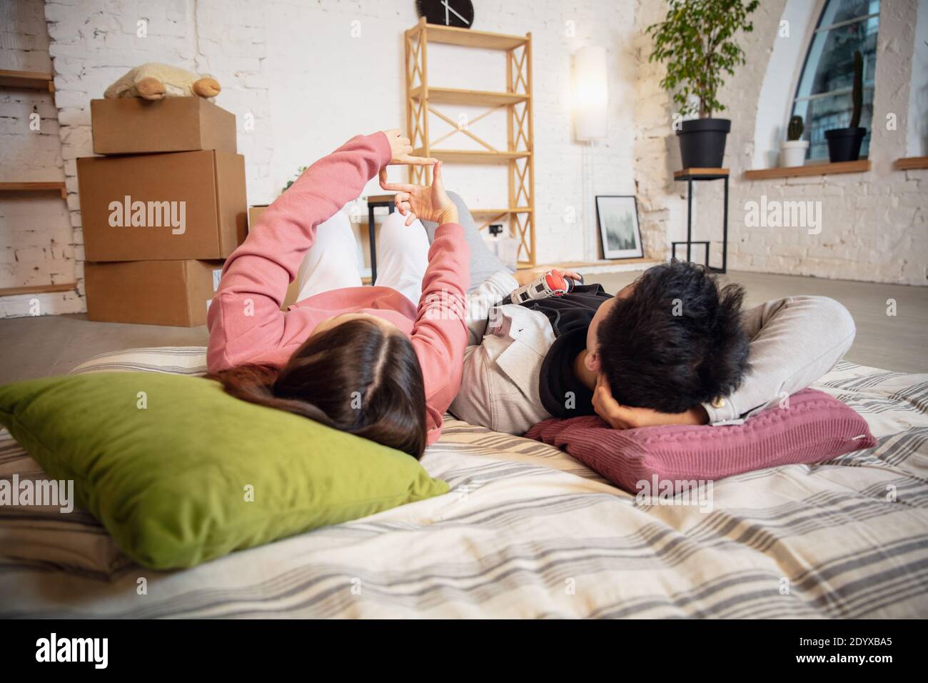 Future plans. New property owners, young couple moving to new home ...