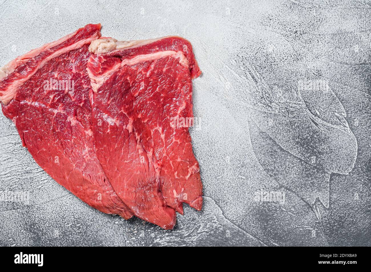 Raw fresh veal meat chop steak. White background. Top view. Copy space ...