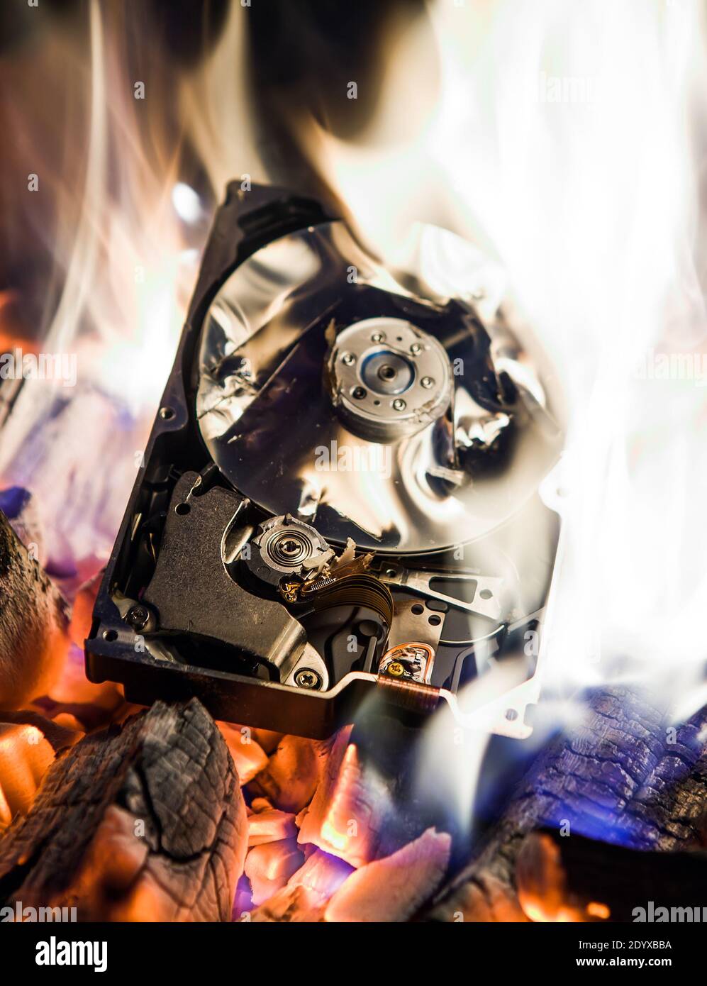 Crushed Hard Disk Drive in the Fire Stock Photo - Alamy