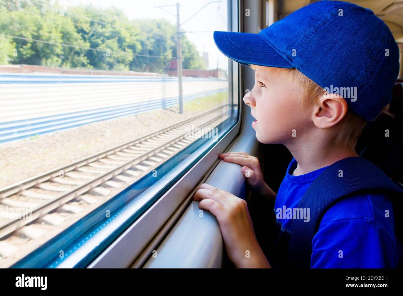 Child Boy in the Train by the Window Stock Photo - Alamy