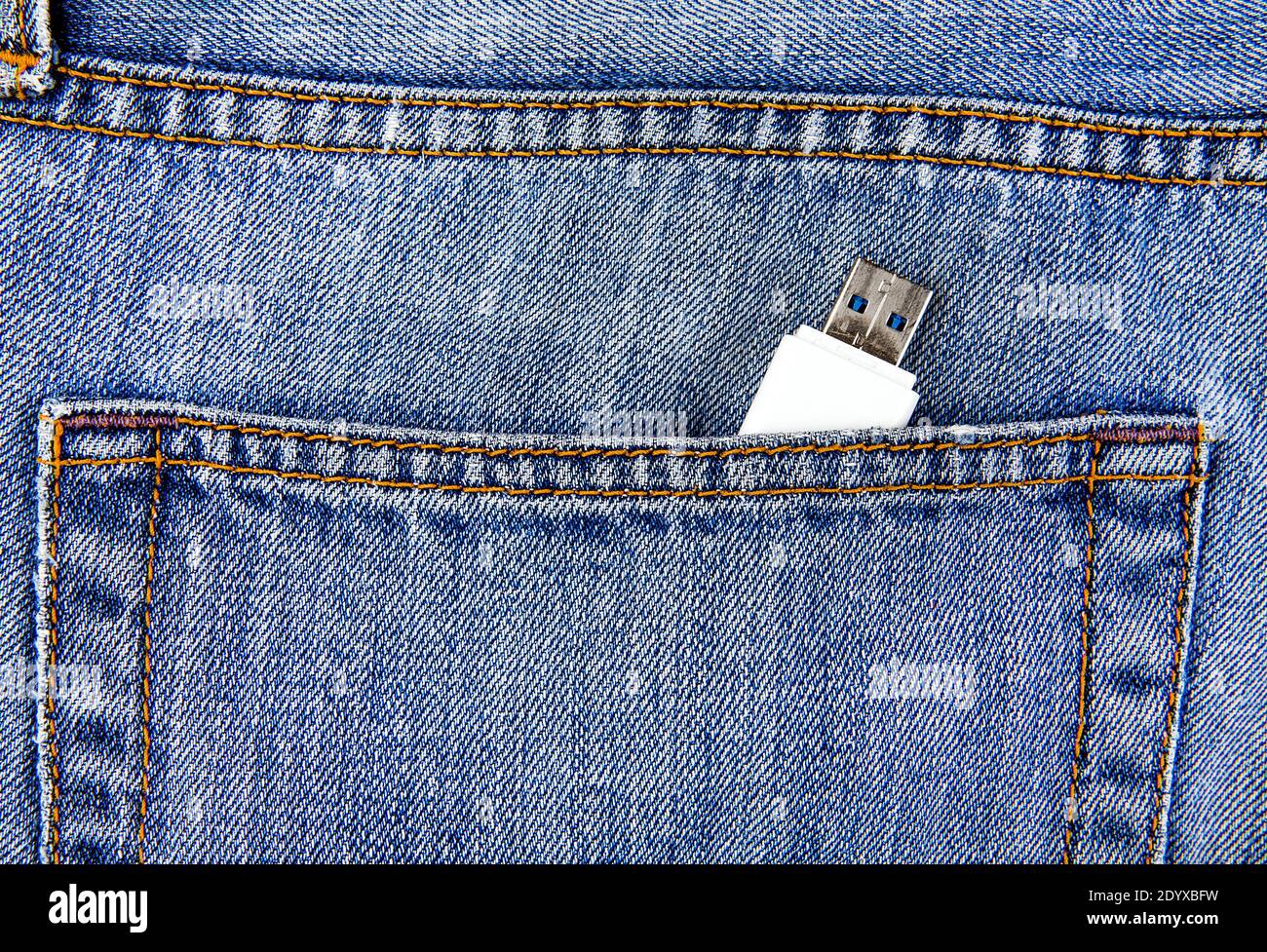 USB Flash Drive in the Jeans Pocket closeup Stock Photo - Alamy