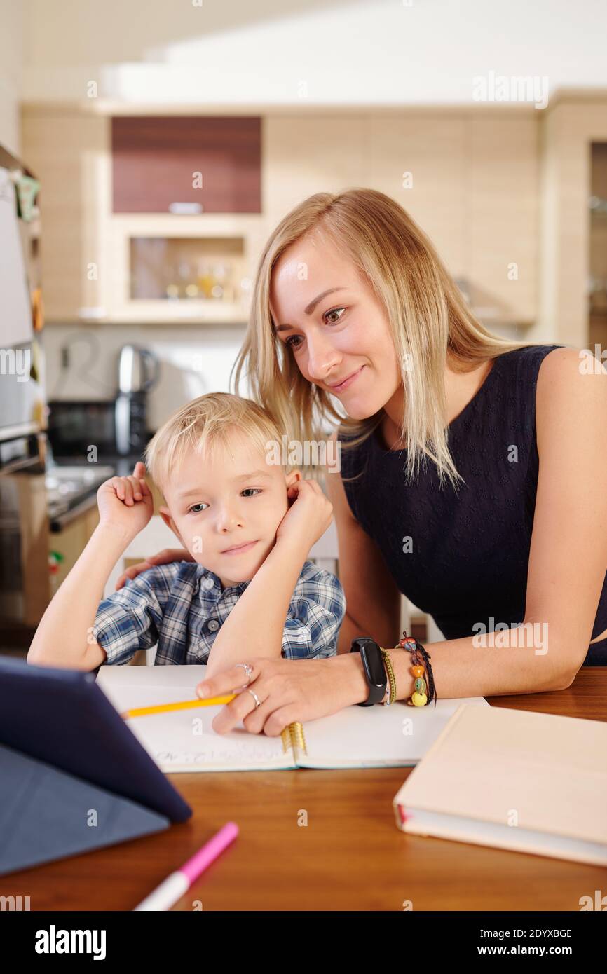 Child solving equation book hi-res stock photography and images - Alamy
