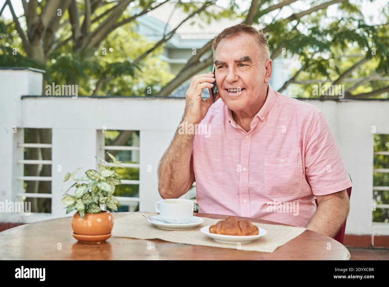 Senior man eating breakfast Stock Photo - Alamy