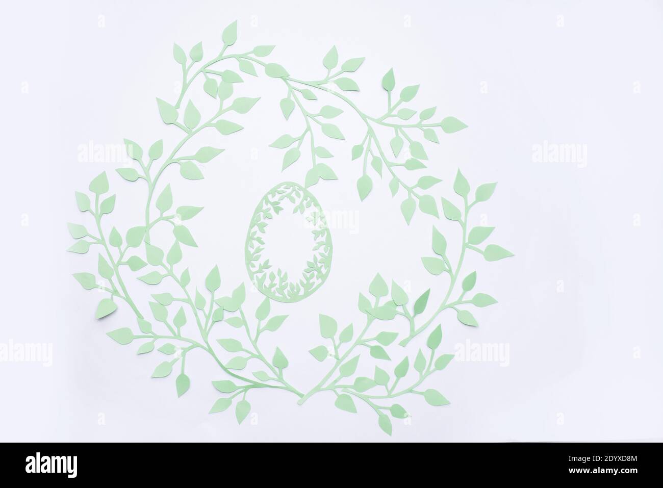 easter leaves frame of cut paper and egg on white background Stock ...