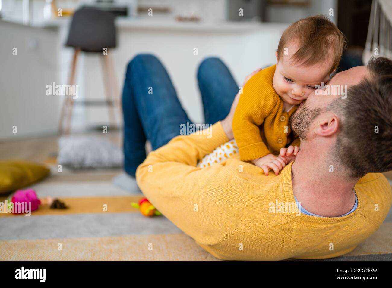 Young father is having fun with his little baby Stock Photo - Alamy