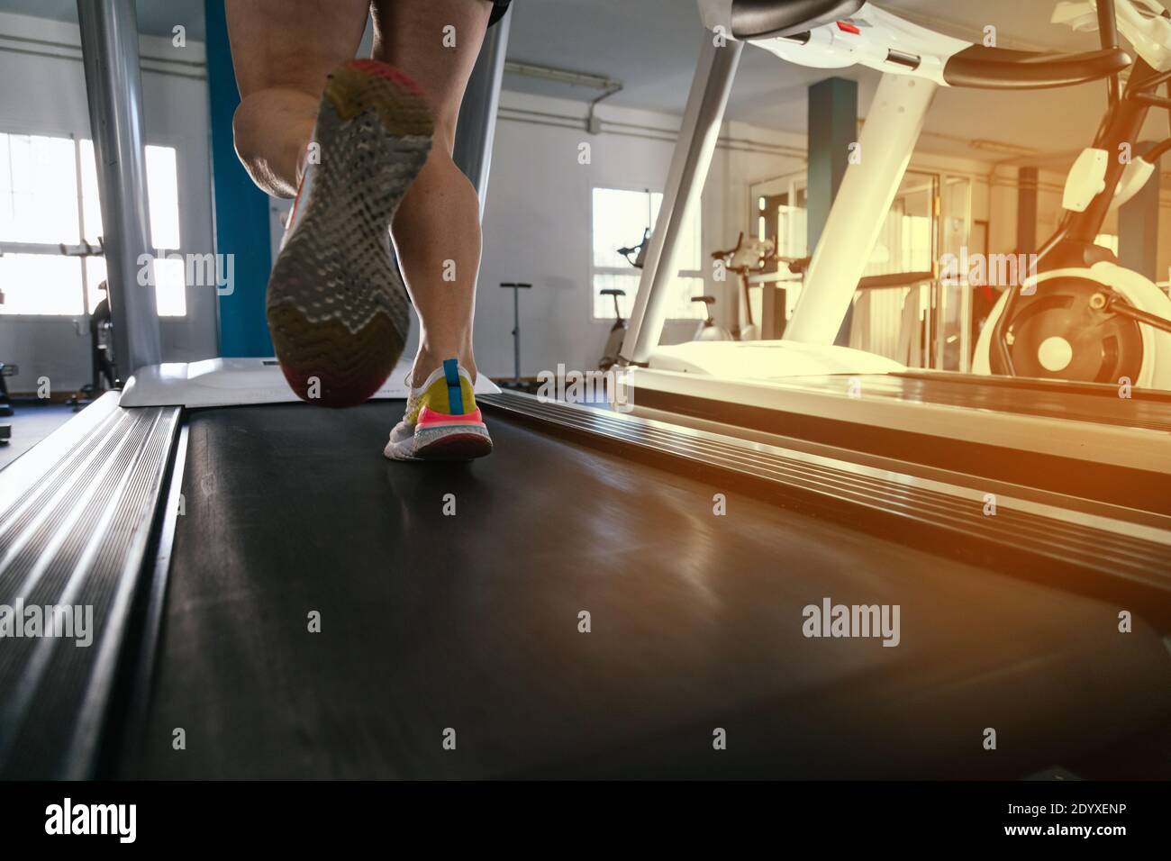 treadmill runner at the gym. close-up the foot Stock Photo - Alamy