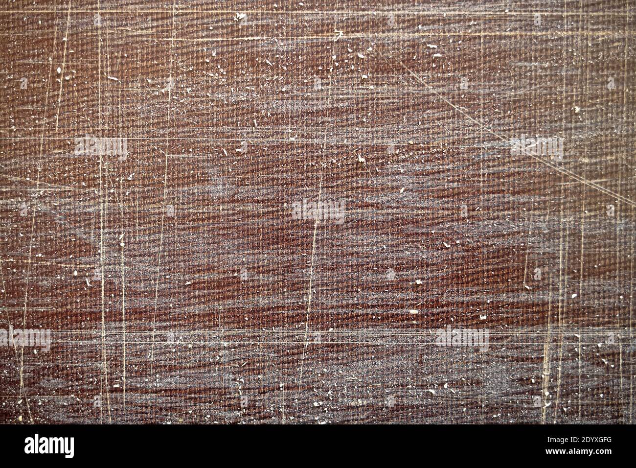 Abstract background. An empty brown surface of the PCB with scratches ...