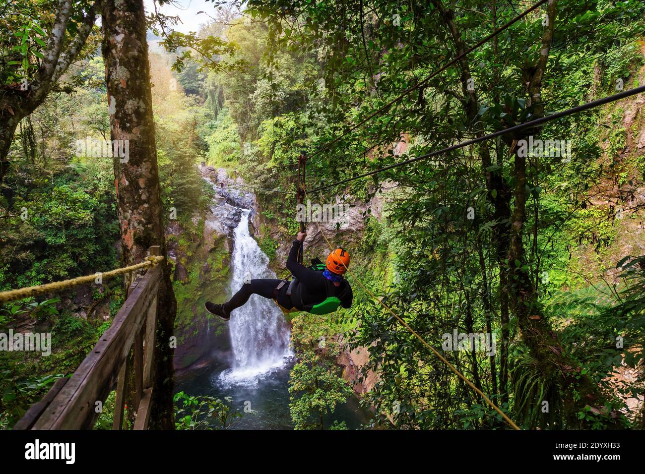 Adult man on zip line hi-res stock photography and images - Alamy