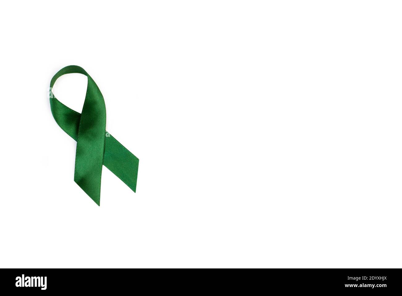 A green ribbon on a white background with copy space Stock Photo - Alamy