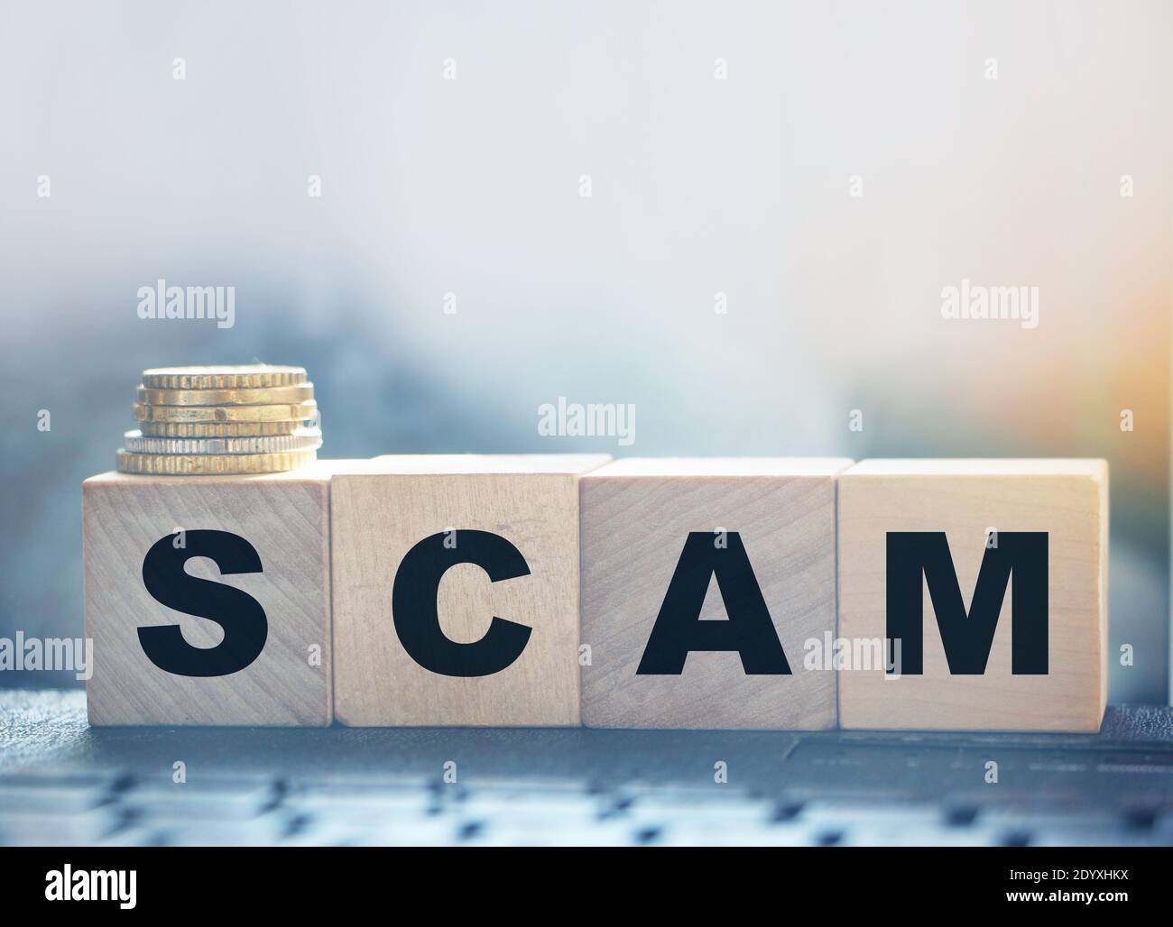 Word SCAM. Wooden small cubes with letters isolated on computer ...