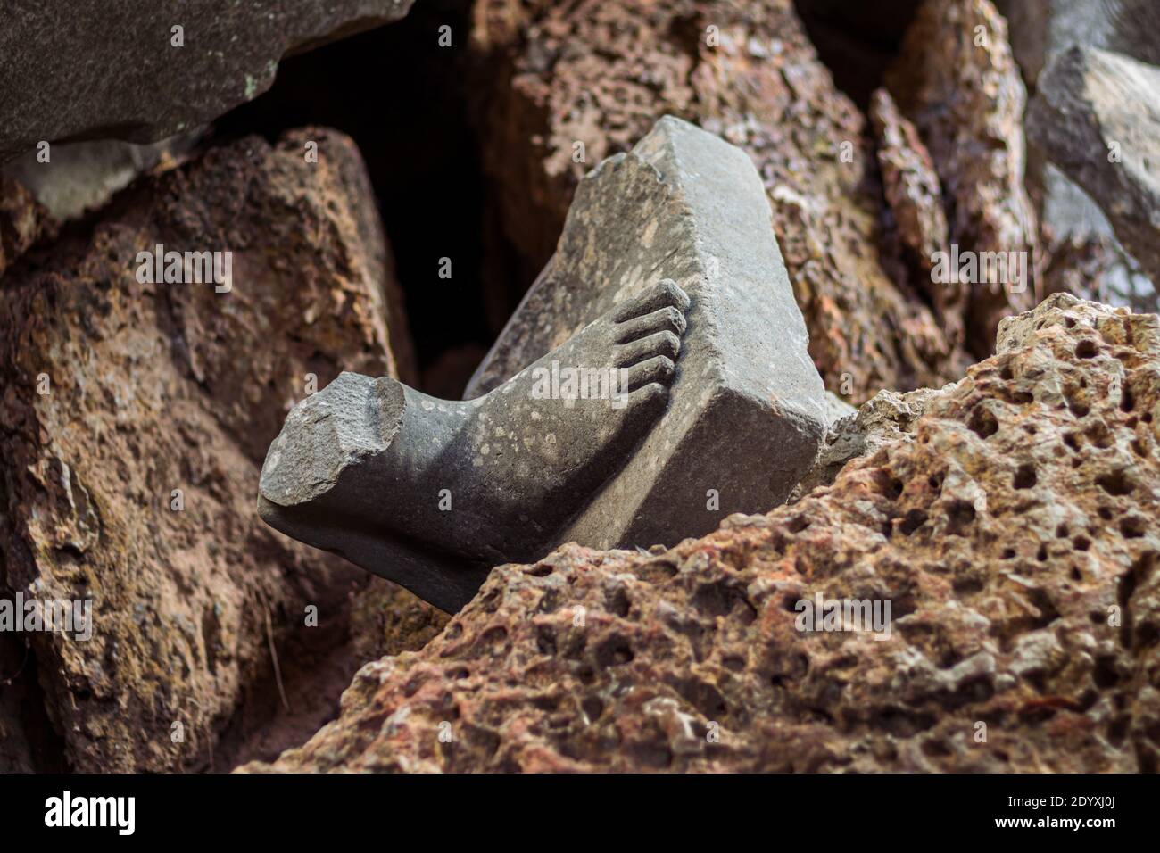 Foot of a broken statue, Angkor Wat, Cambodia Stock Photo - Alamy