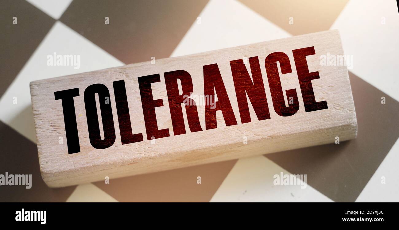 Tolerance Word In Wooden block put on chessboard. Equality, diversity ...