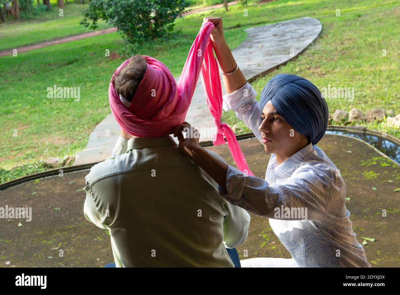TAMIL NADU, INDIA - November 2020: Tying a Sikh turban before a ...
