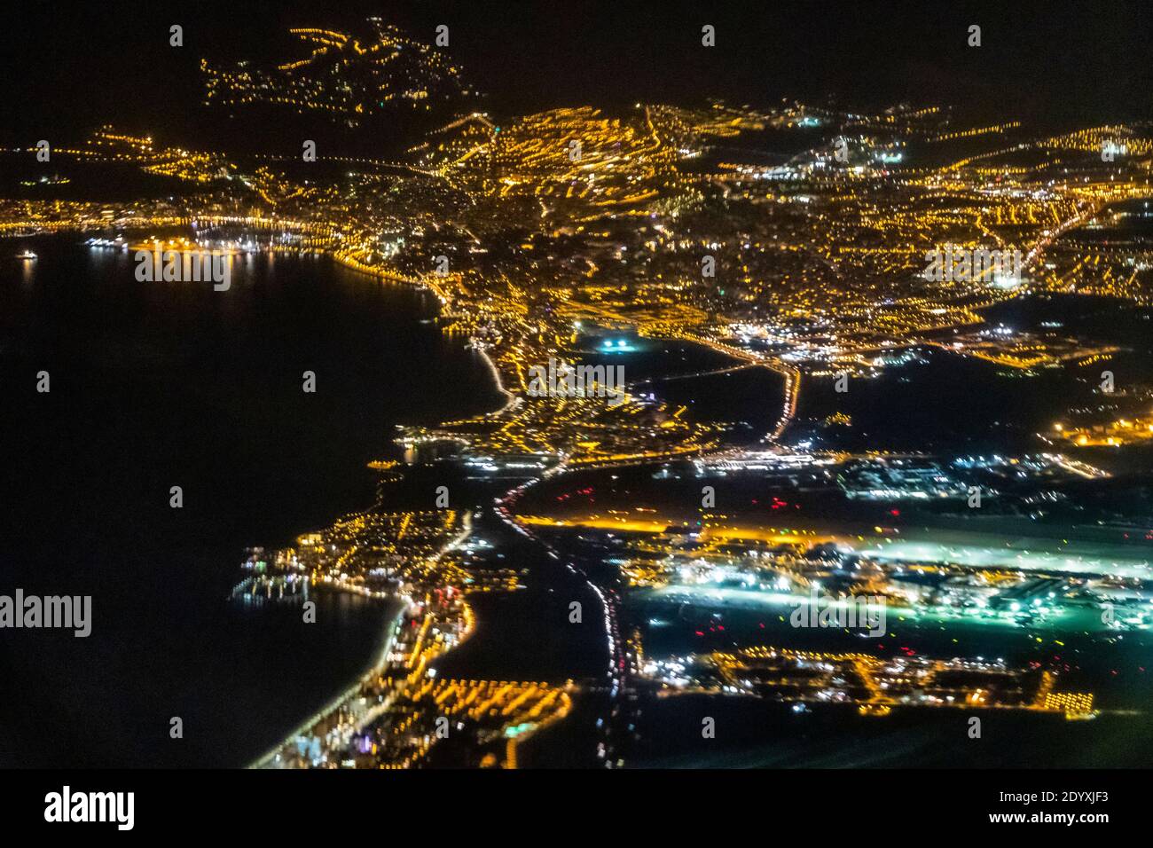 Flying over Spain Palma de Mallorca at night with view out of the ...