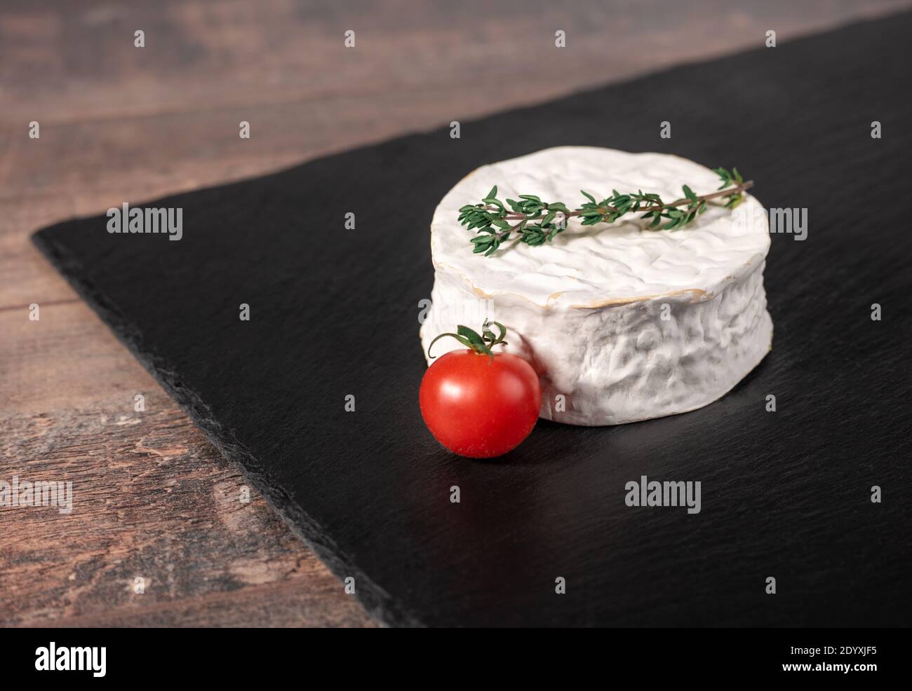 Delicious brie cheese on black background. Brie type of cheese ...