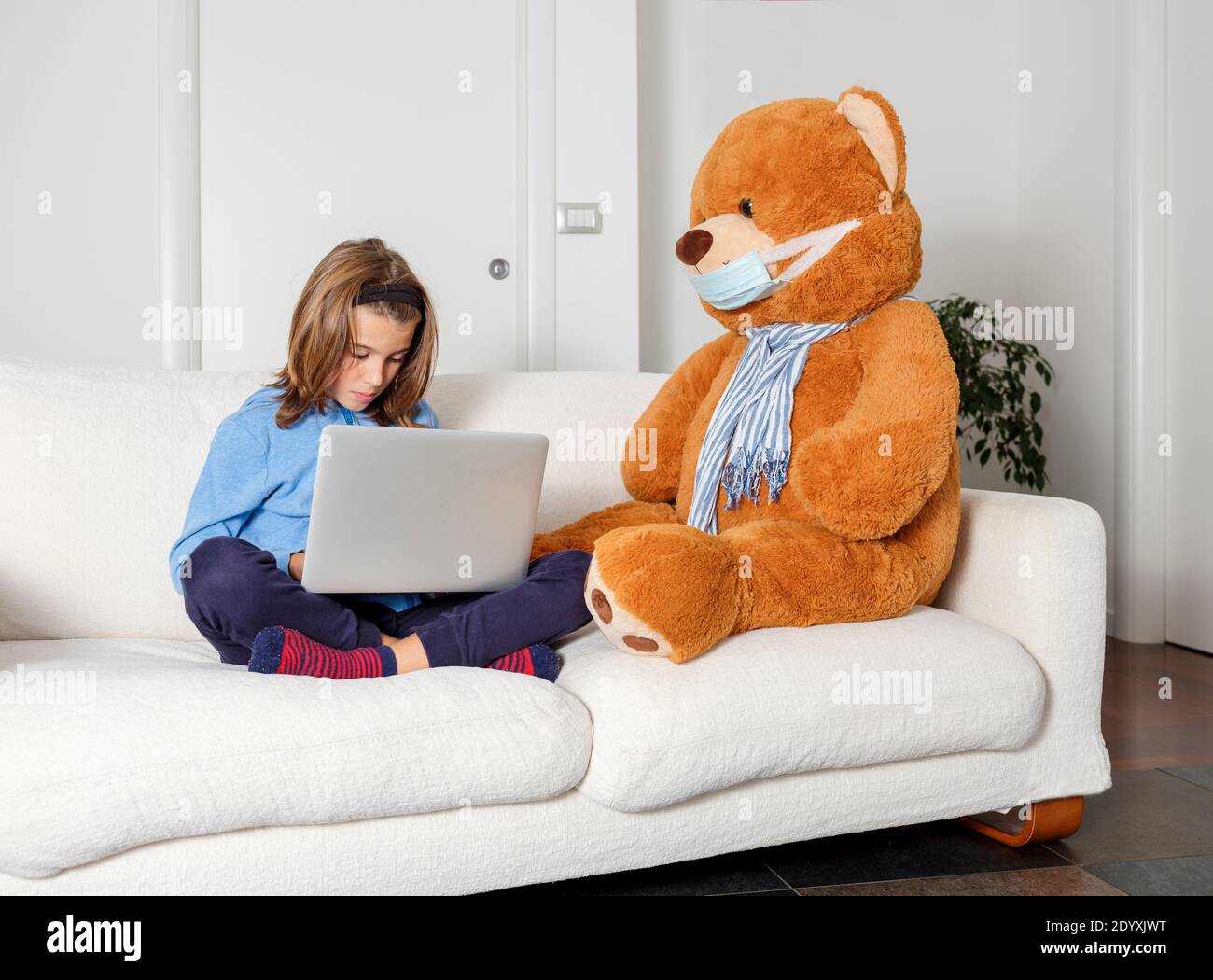 Child studies at home, wear protective masks, and doing school homework ...