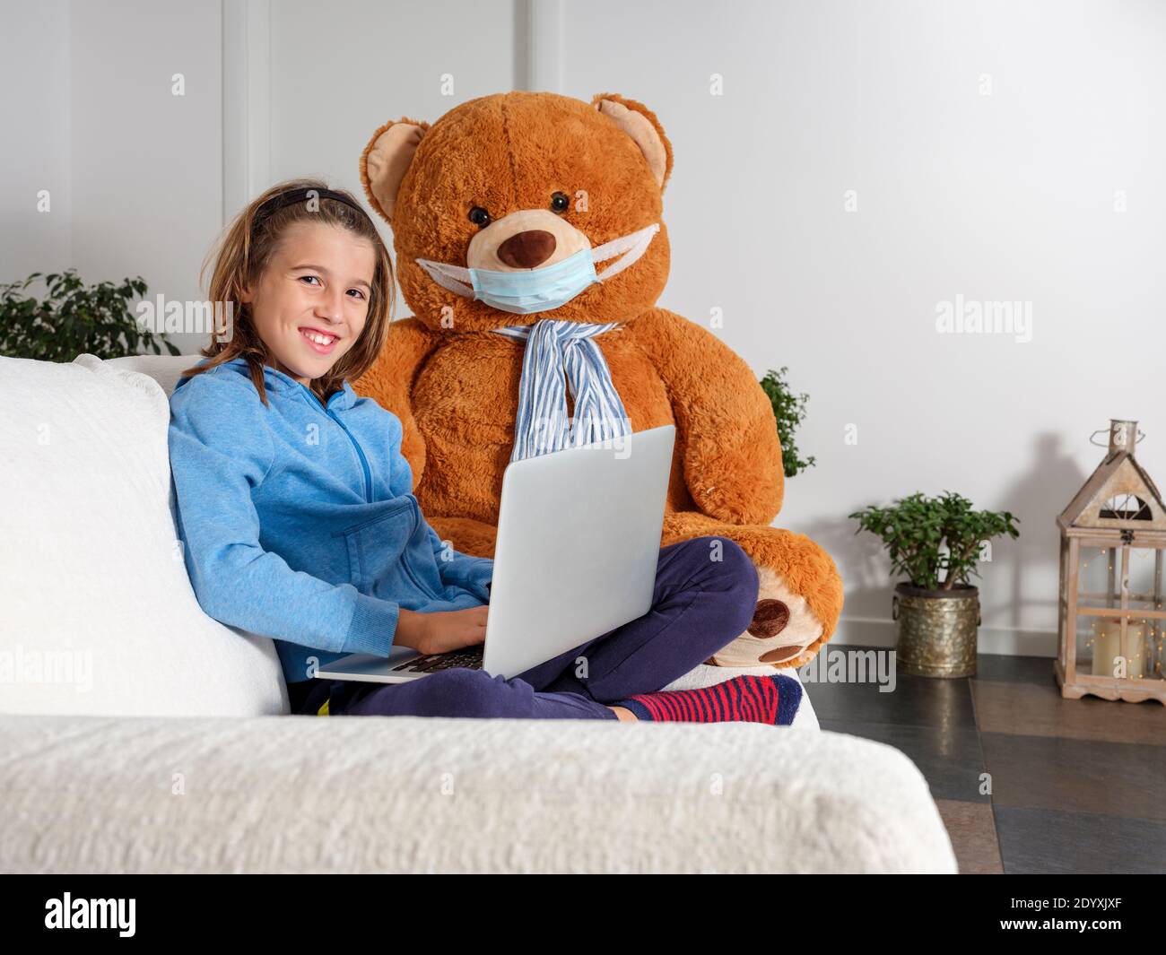 Child studies at home, wear protective masks, and doing school homework ...